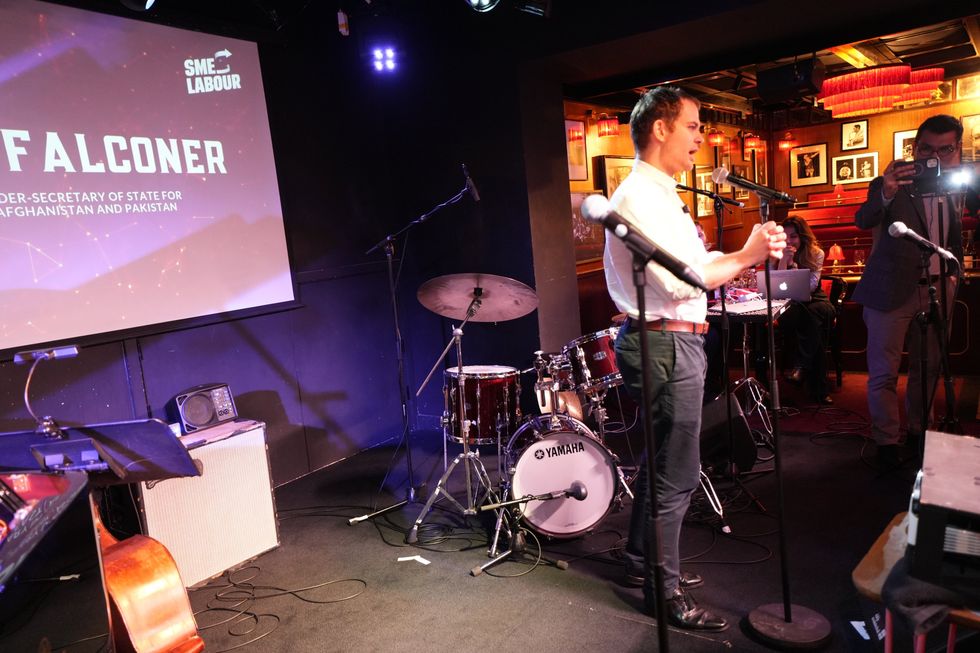Hamish Falconer: Labour Minister pictured on stage at glitzy London ...