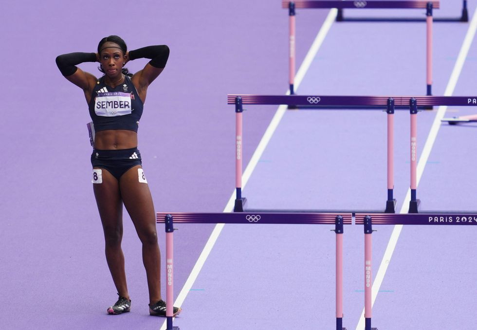 British female sprinter clatters chest-first into hurdles in scary ...