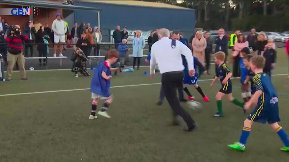 Australian PM Scott Morrison flattens eight-year-old child in football ...