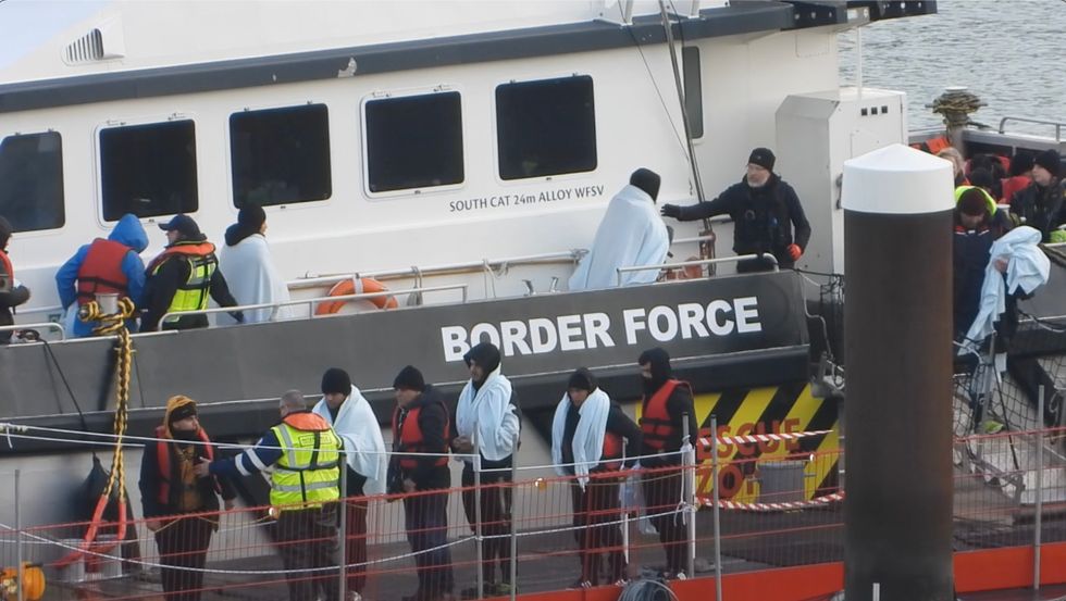 HUNDREDS of migrants arrive in small boats after bad weather prevented ...